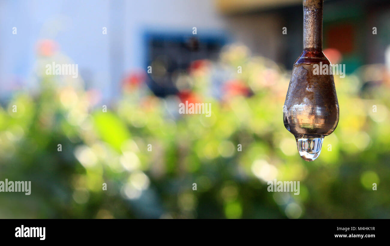 drop of water dripping from the washbasin in the village Stock Photo ...