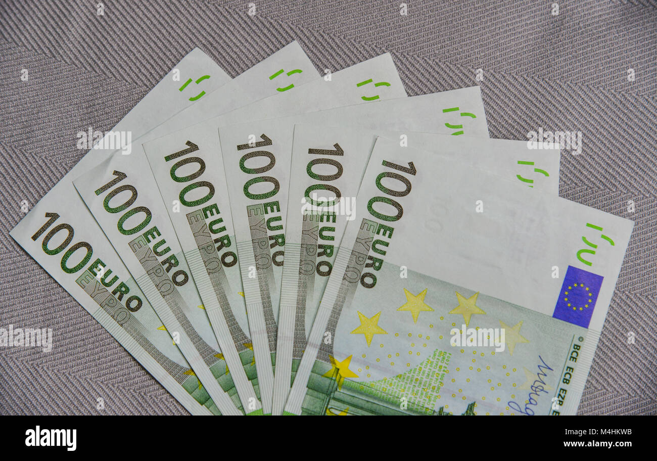 Group of Euro banknotes (100 EUR) on white background. Finance concept ...
