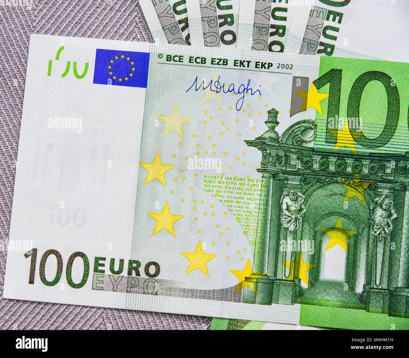 Group of Euro banknotes (100 EUR) on white background. Texture of ...