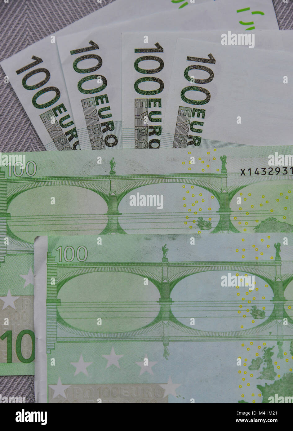 Group of Euro banknotes (100 EUR) on textile background. Texture of ...