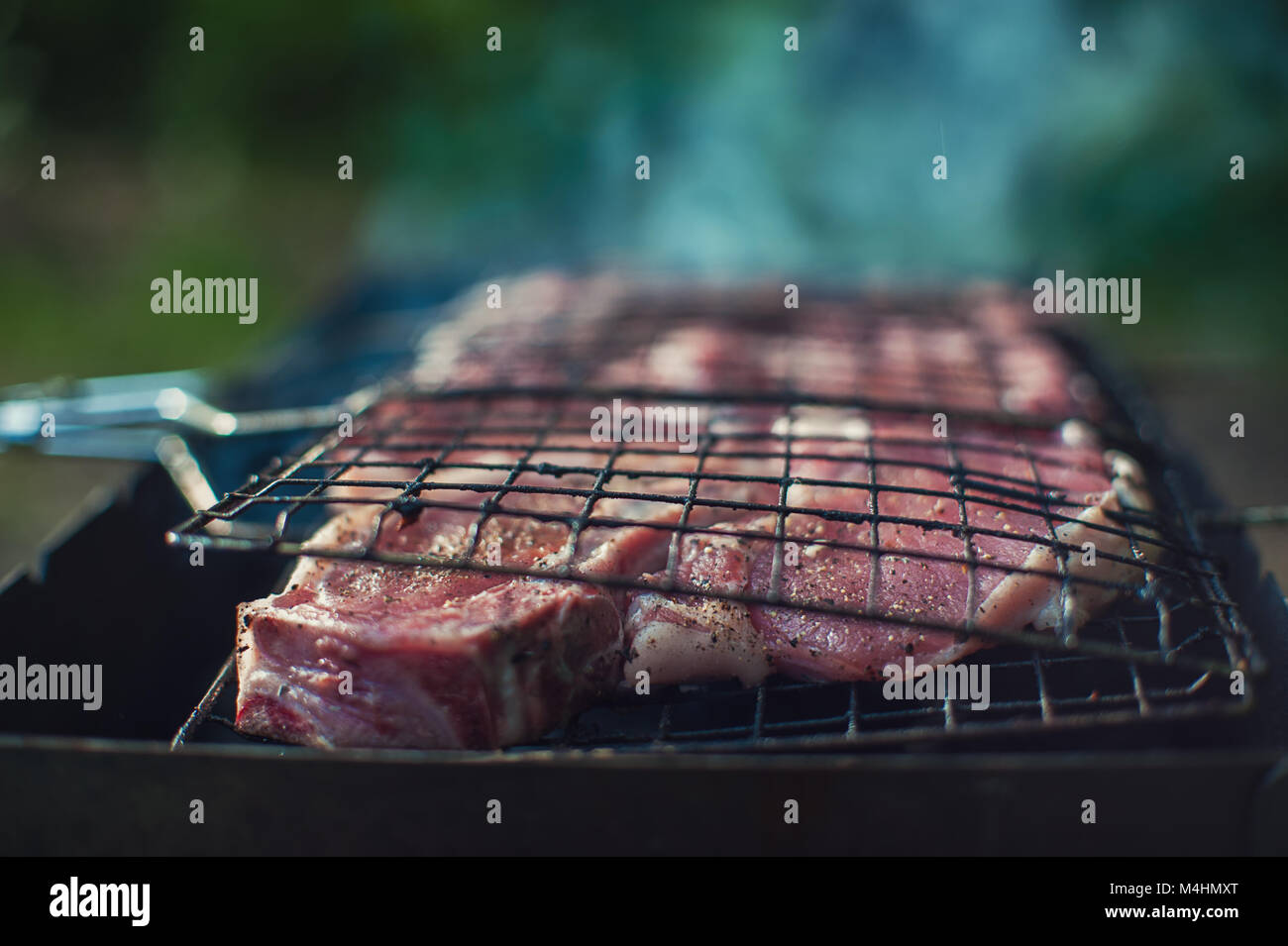 Grilling fresh entrecote pork Stock Photo - Alamy