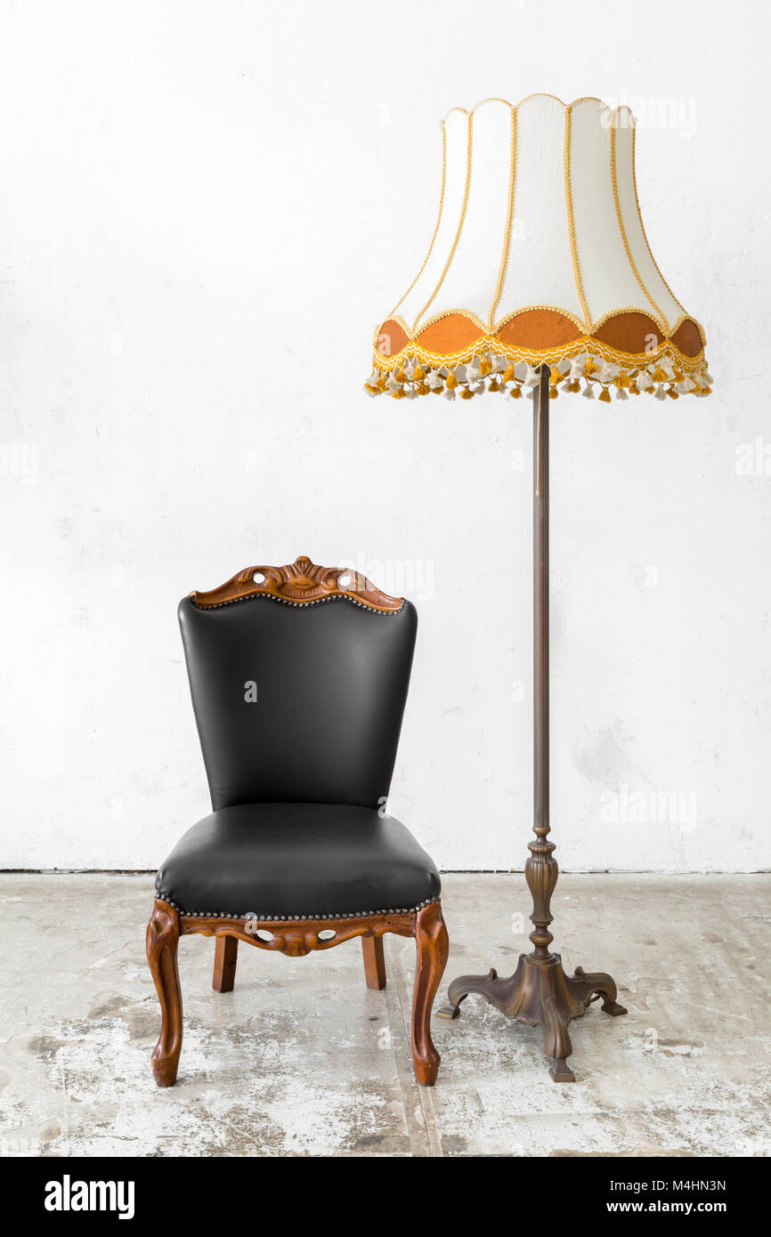 Black chair with lamp Stock Photo - Alamy