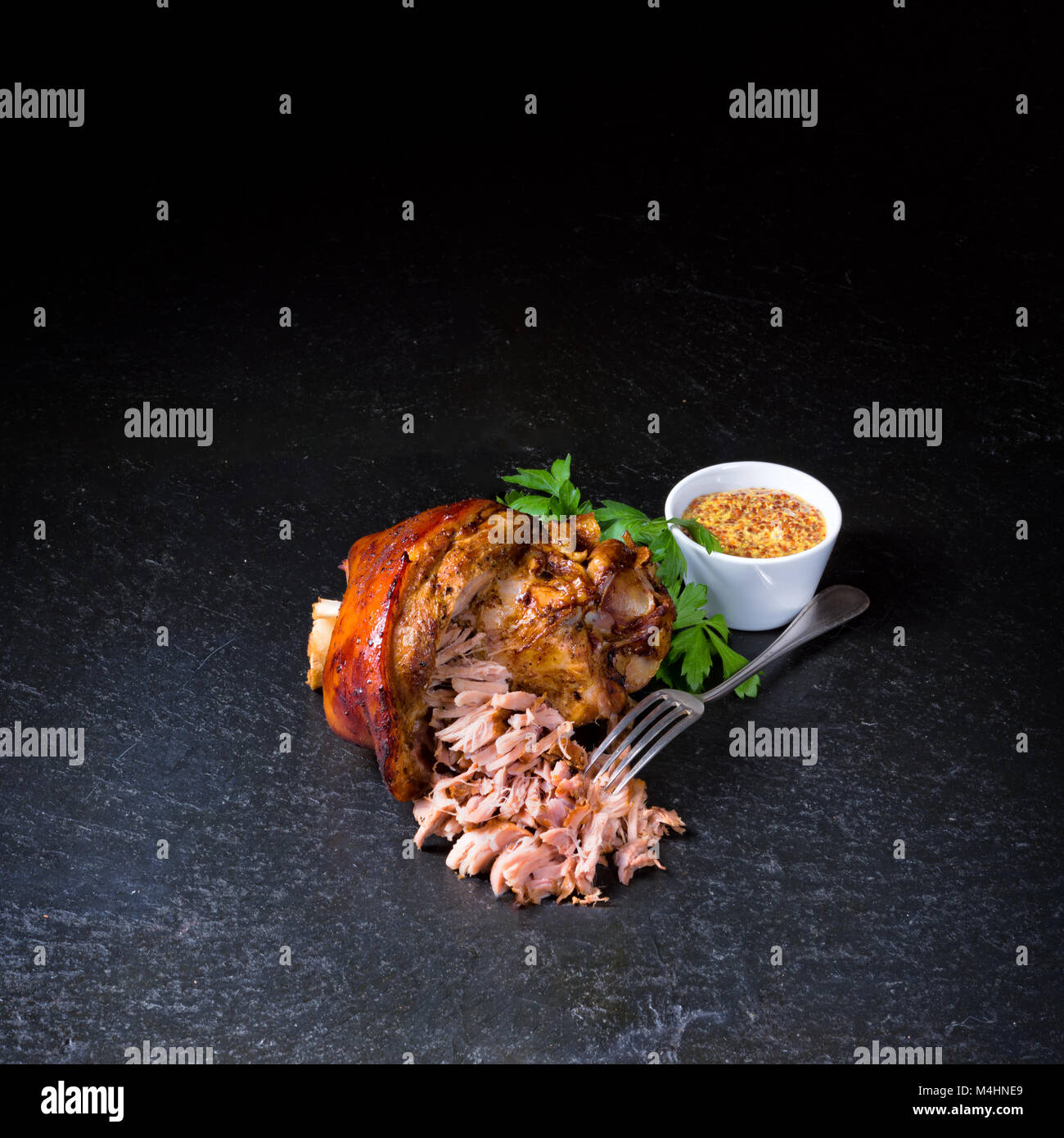 fresh roasted knuckle of pork with mustard Stock Photo - Alamy