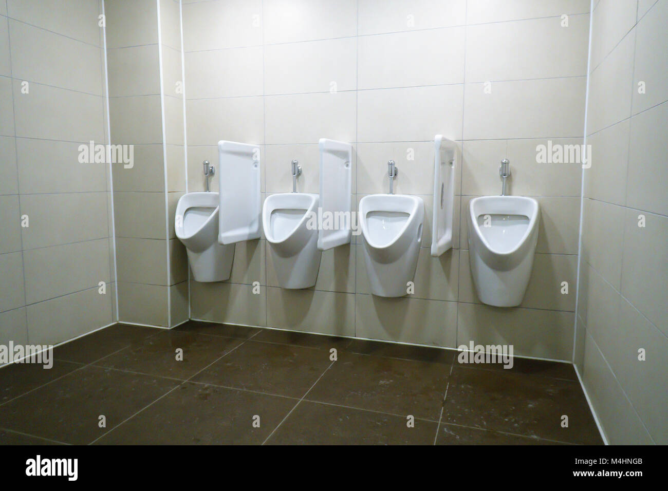 modern restroom interior with urinal row Stock Photo - Alamy
