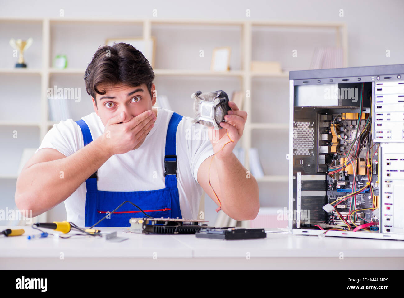 Computer repairman repairing desktop computer Stock Photo - Alamy