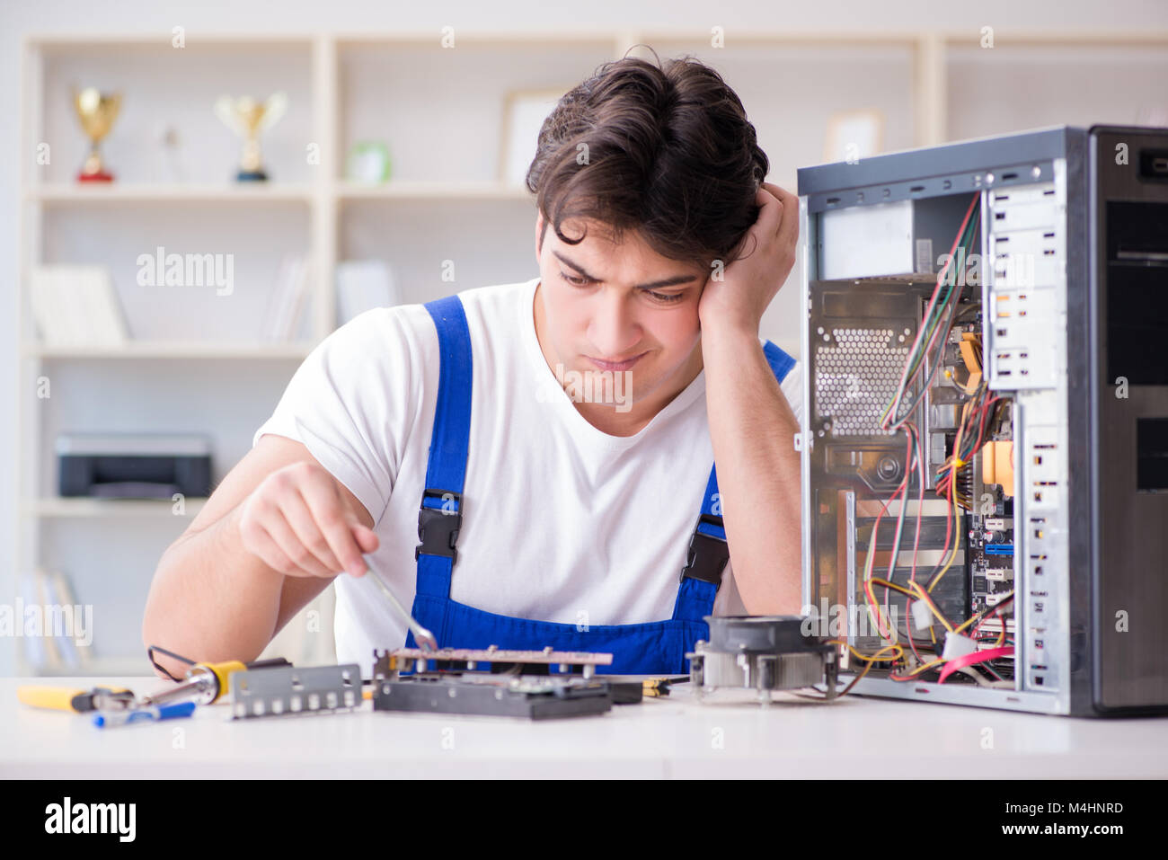 Computer repairman repairing desktop computer Stock Photo - Alamy