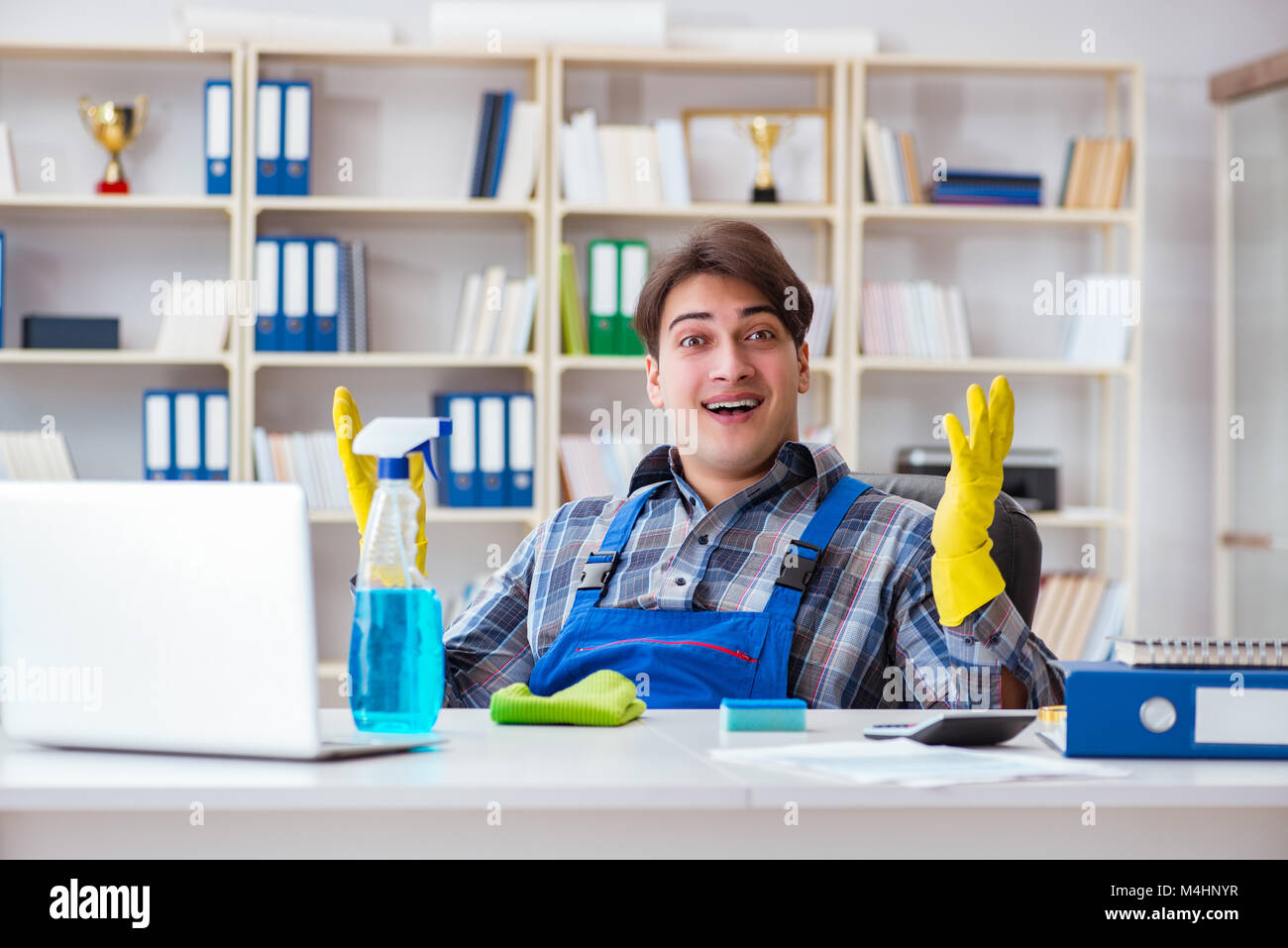 Male cleaner working in the office Stock Photo - Alamy