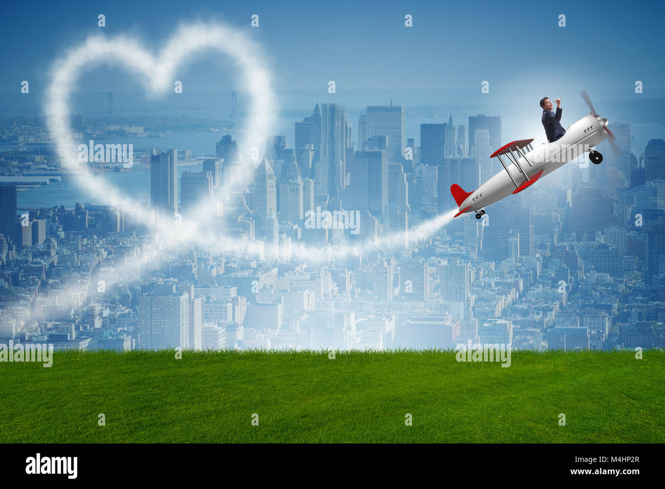Man flying airplane and making heart shape Stock Photo - Alamy