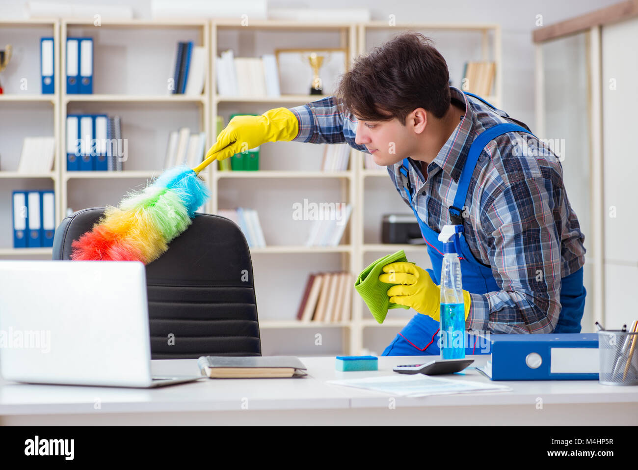 Male cleaner working in the office Stock Photo - Alamy