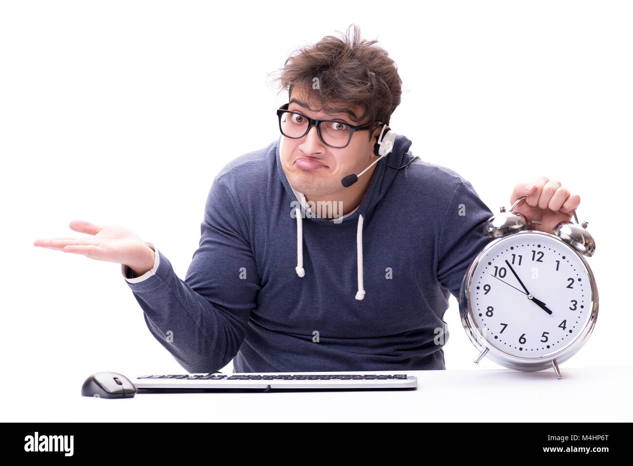 Funny nerd call center operator with giant clock Stock Photo - Alamy