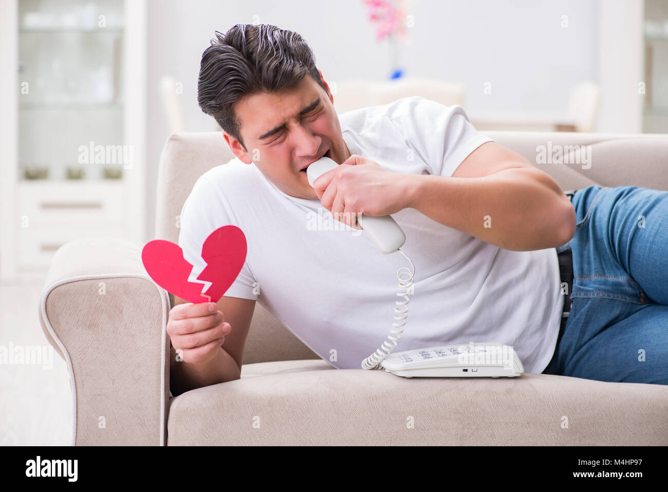 Young man in sad saint valentine concept Stock Photo - Alamy