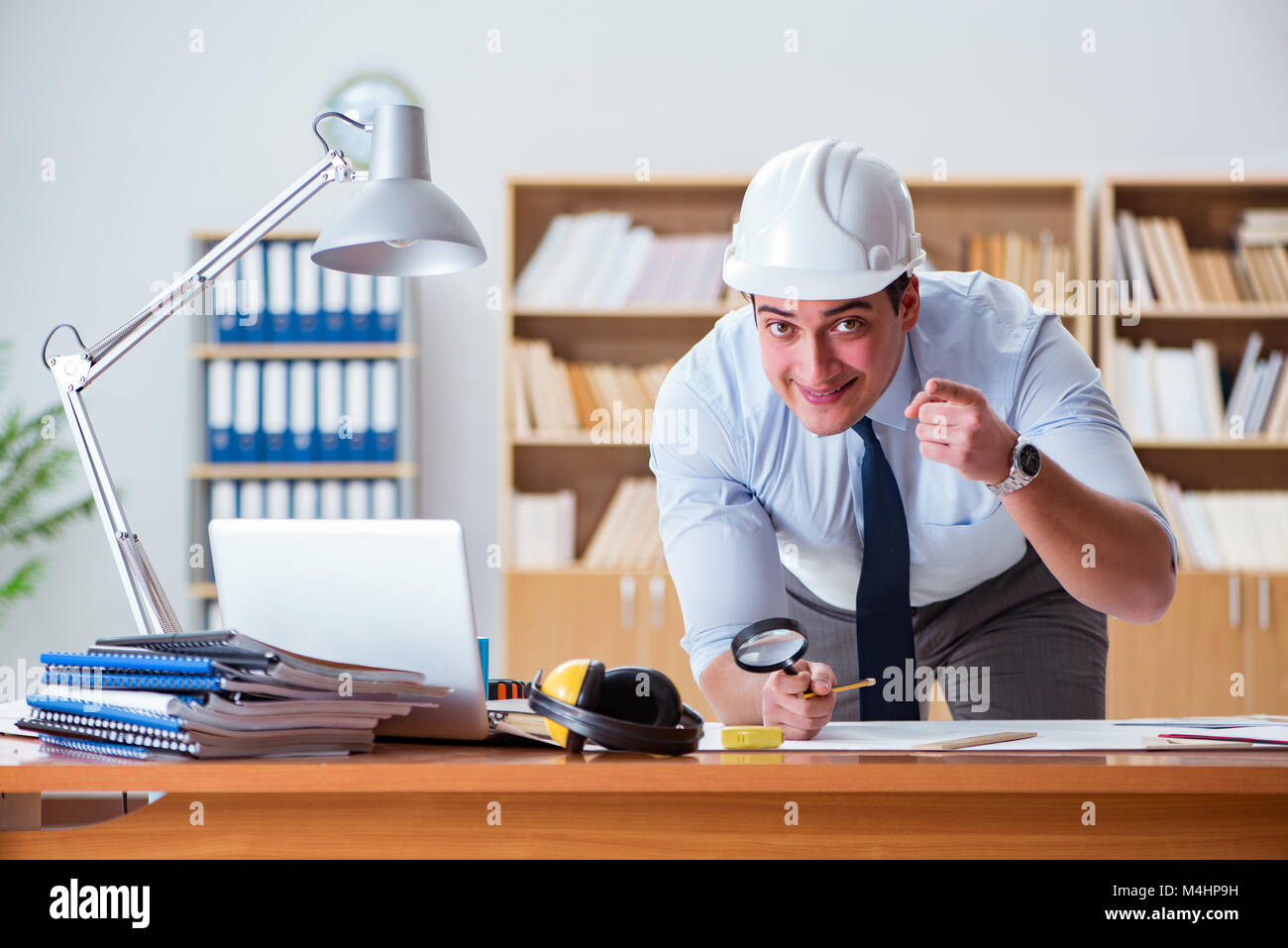 Engineer supervisor working on drawings in the office Stock Photo - Alamy
