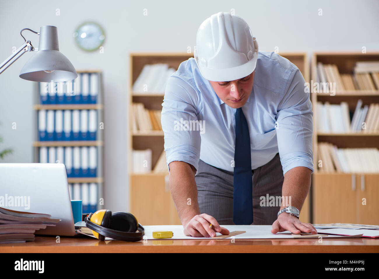 Engineer supervisor working on drawings in the office Stock Photo - Alamy