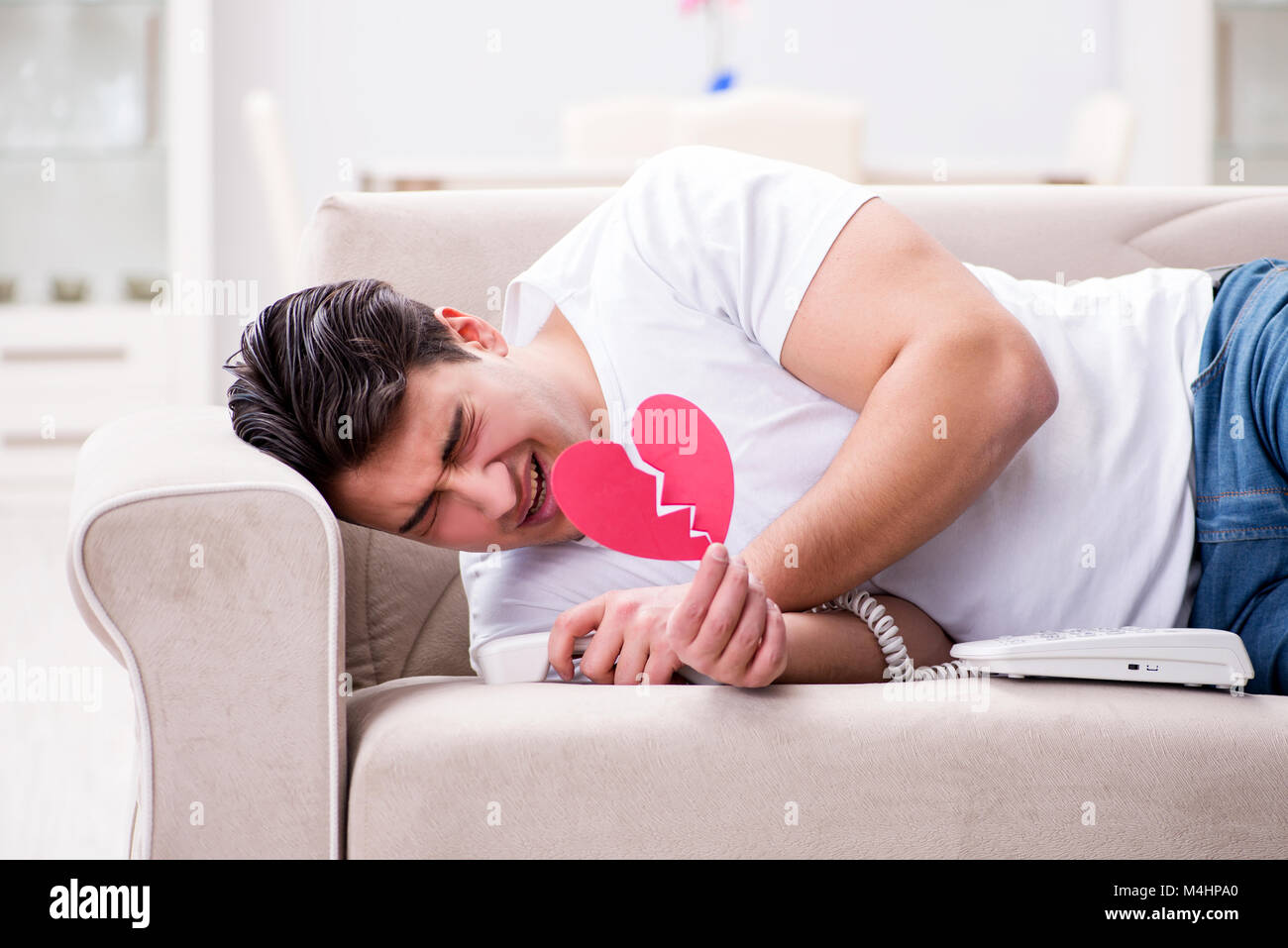 Young man in sad saint valentine concept Stock Photo - Alamy