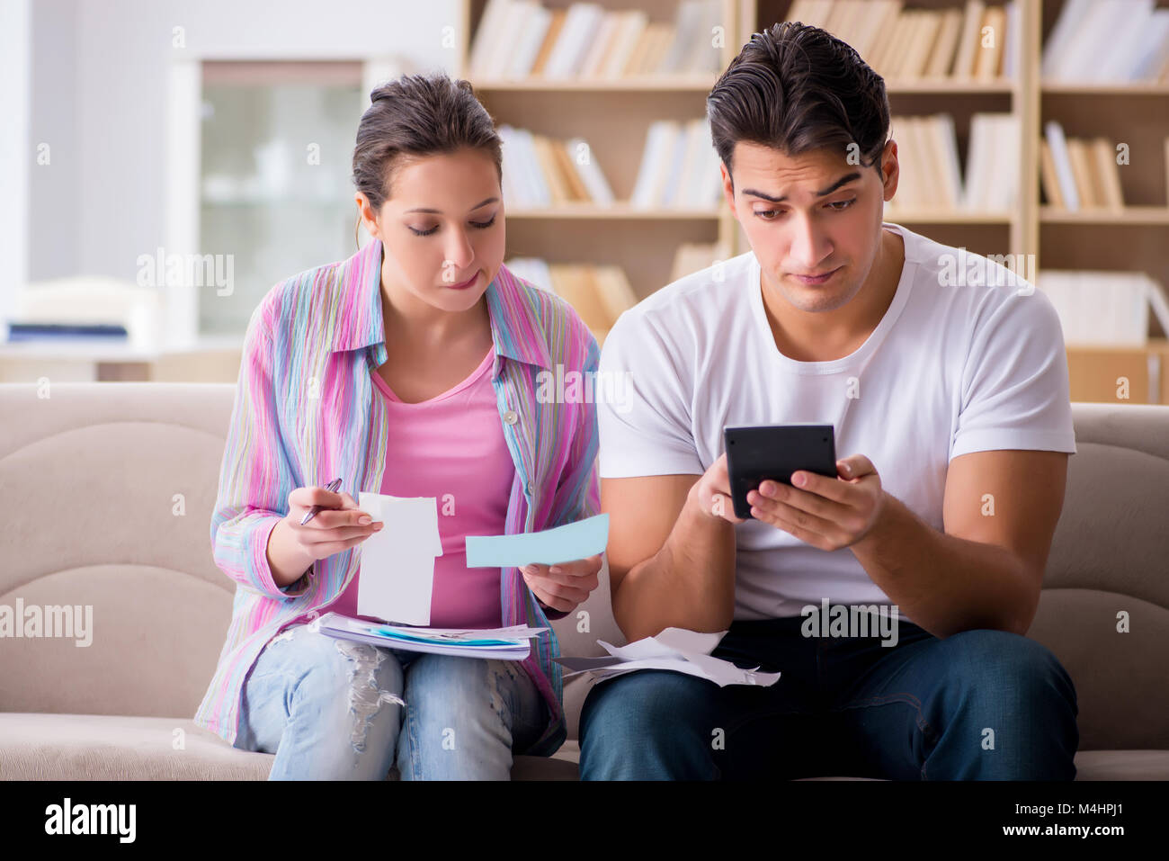 Young family discussing family finances Stock Photo - Alamy