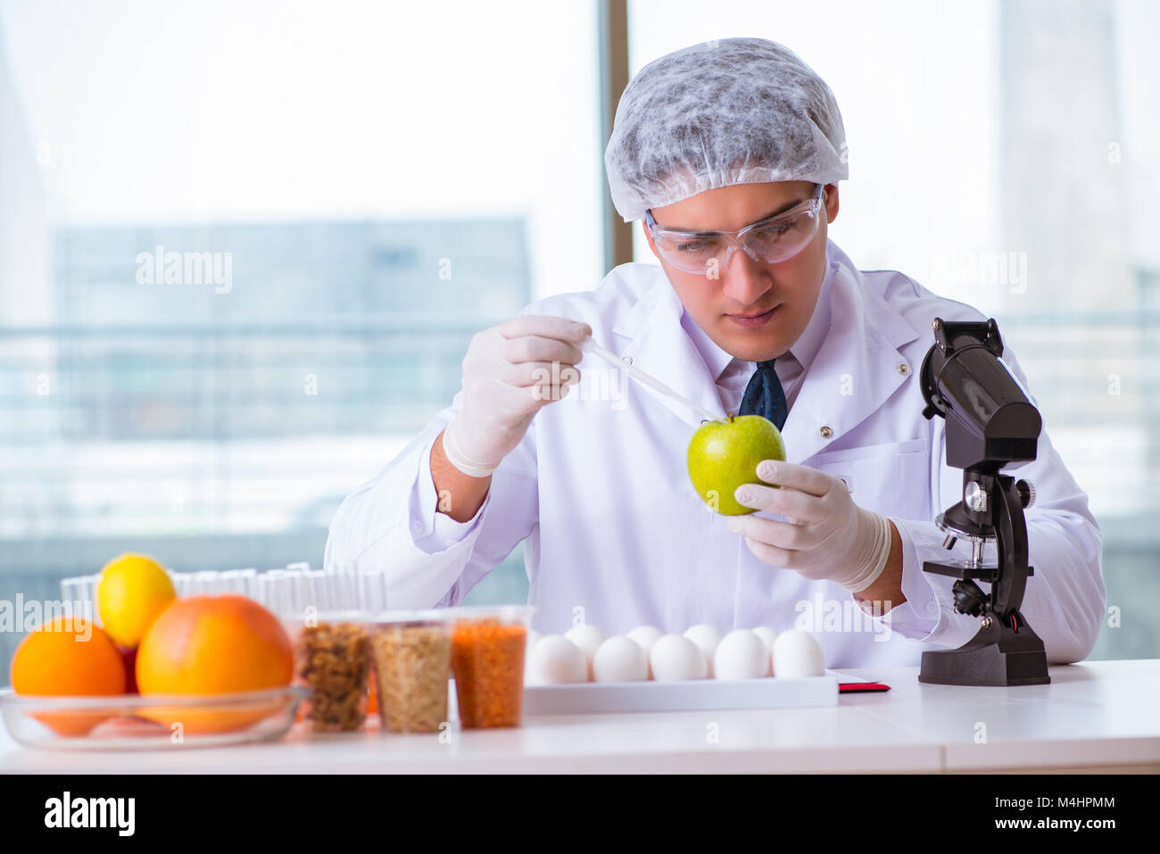Nutrition expert testing food products in lab Stock Photo - Alamy
