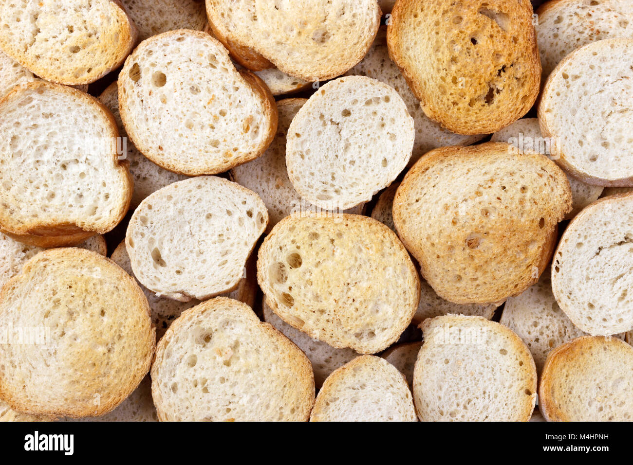 Background from many small round rusks on wooden table. Top view Stock ...