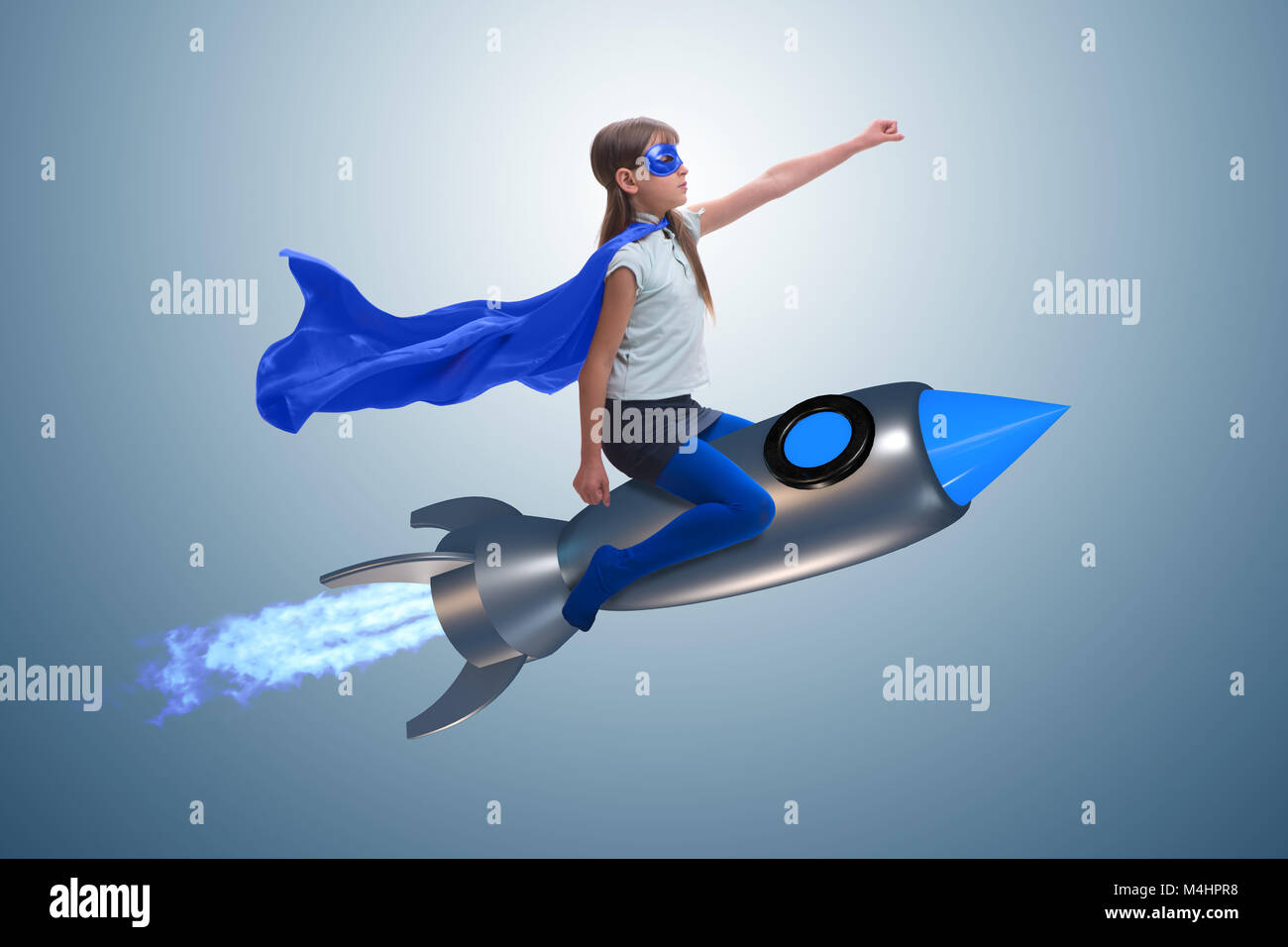 Little girl flying rocket in superhero concept Stock Photo - Alamy
