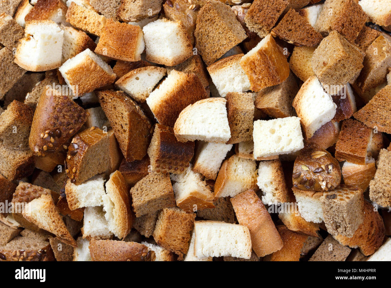 Background from many small rusks on wooden table. Top view Stock Photo ...