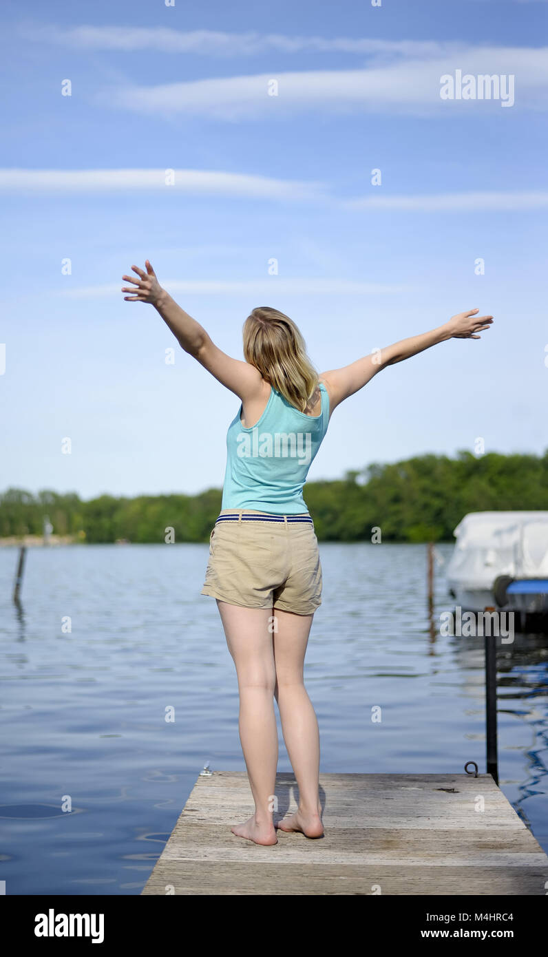 young woman cheering Stock Photo - Alamy