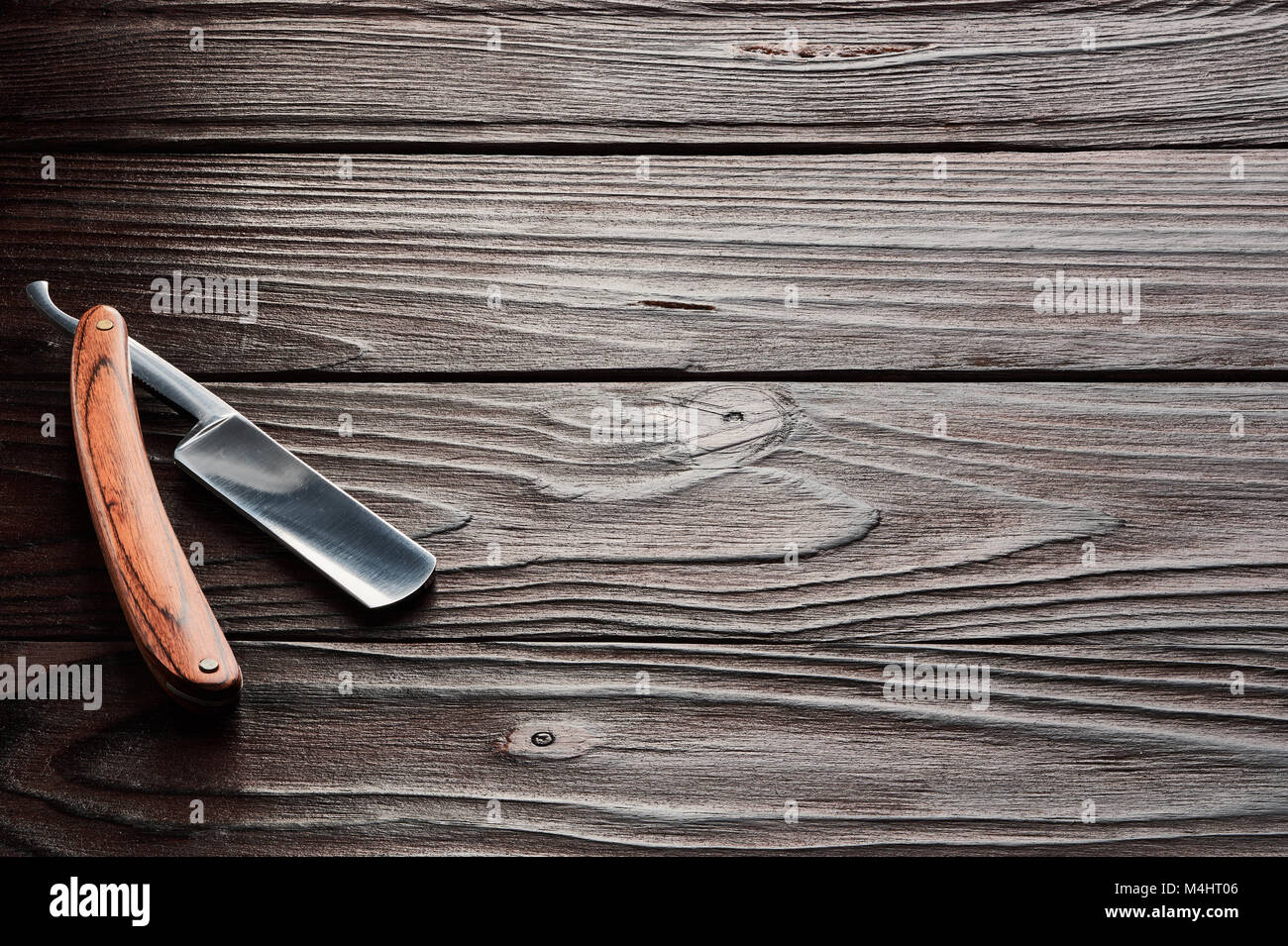Vintage barber shop straight razor tool on wooden background Stock ...