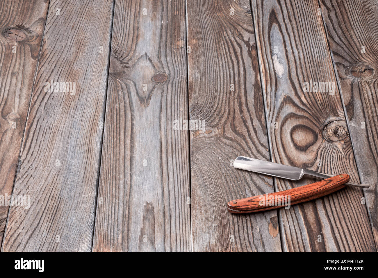 Vintage barber shop straight razor tool on wooden background Stock ...