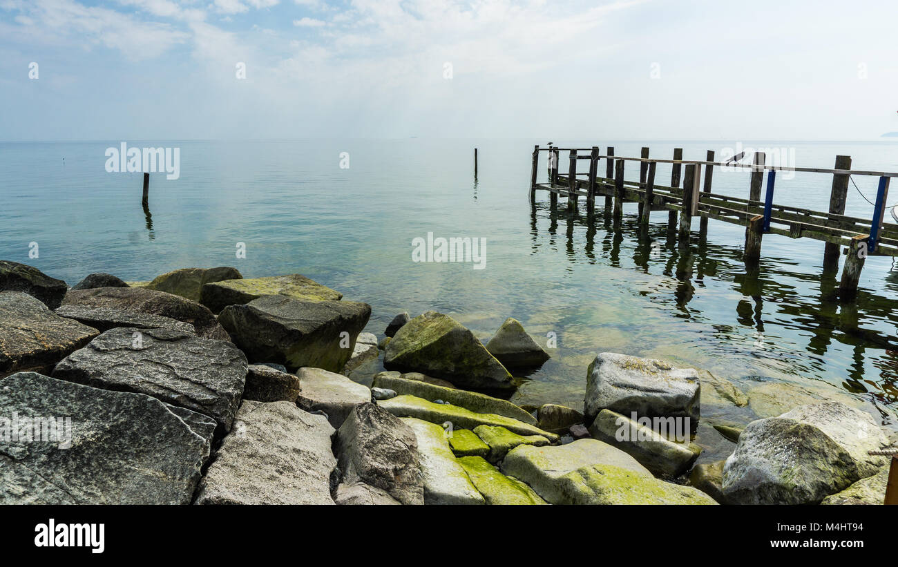 pier and big rocks of breakwater Stock Photo - Alamy
