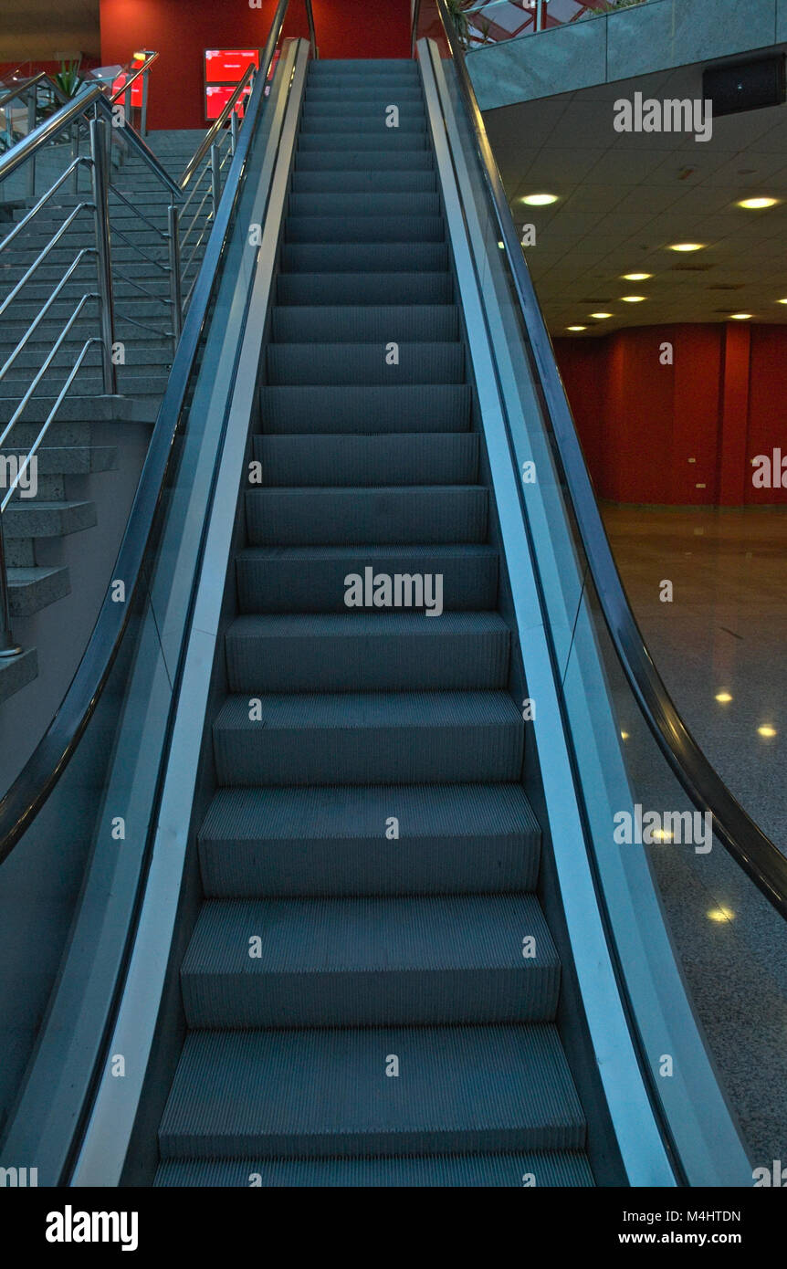 Empty moving stairs in mall going up Stock Photo - Alamy
