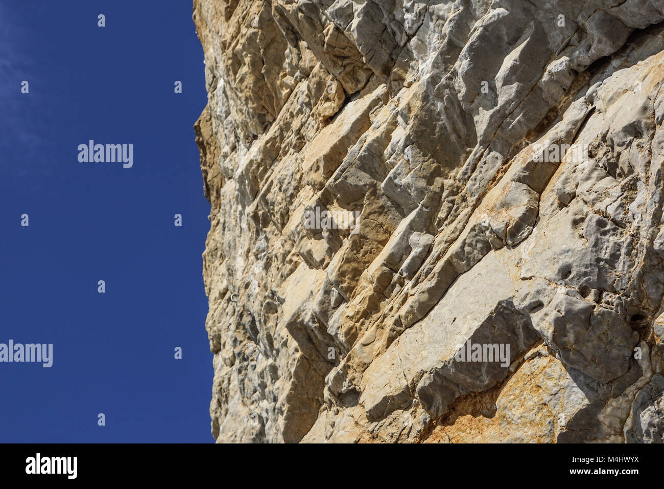 great rock wall, cliff against the blue sky Stock Photo - Alamy