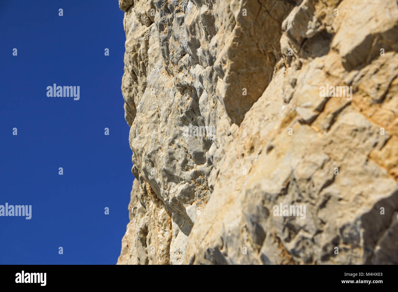 great rock wall, cliff against the blue sky Stock Photo - Alamy