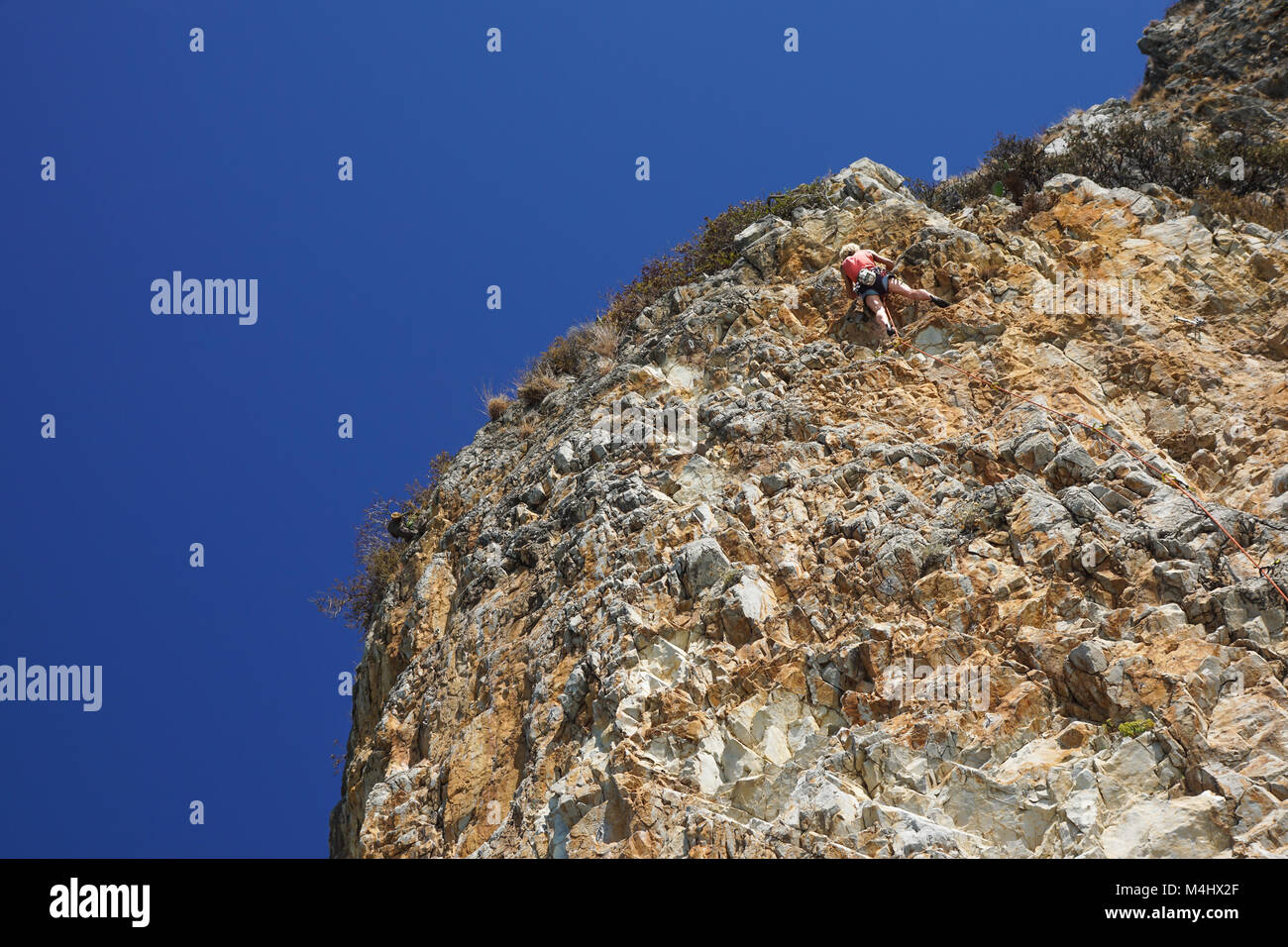 great rock wall, cliff against the blue sky Stock Photo - Alamy