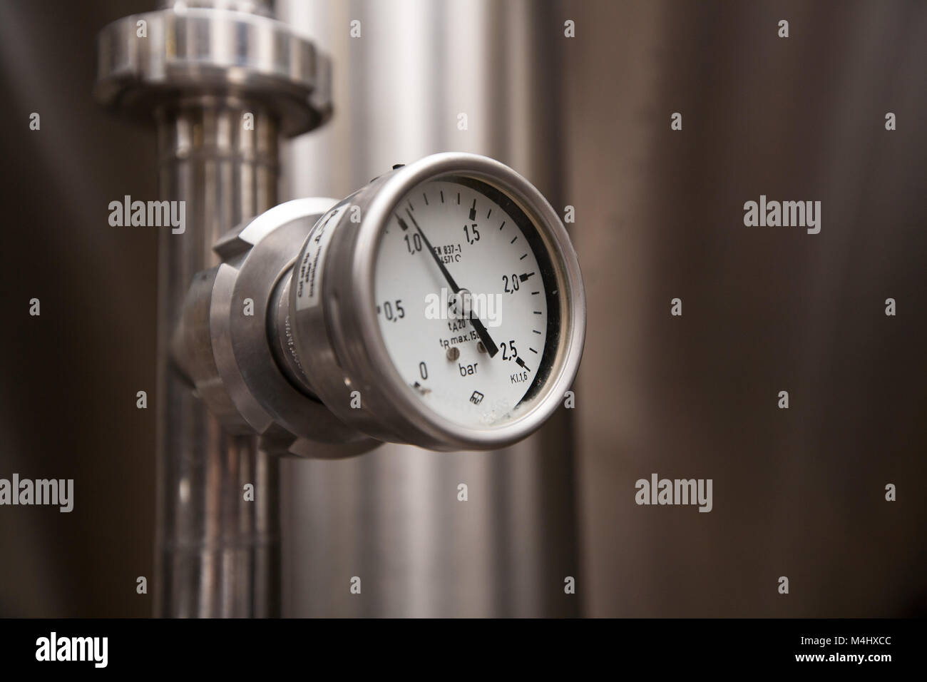 Pressure gauge (manometer) of white metal - brewing equipment. Close-up ...