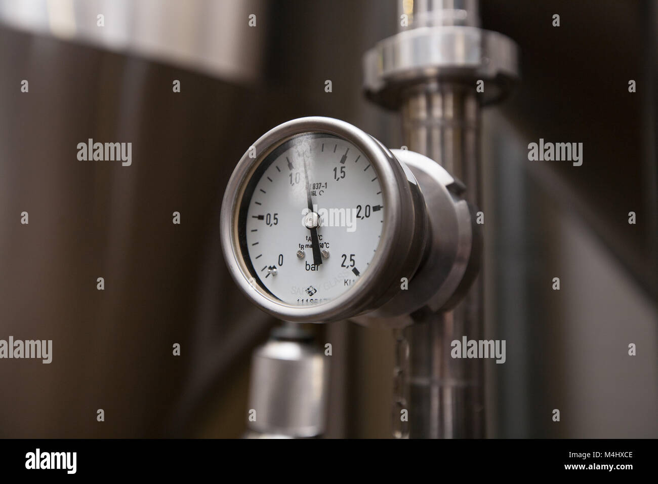Pressure gauge (manometer) of white metal - brewing equipment. Close-up ...