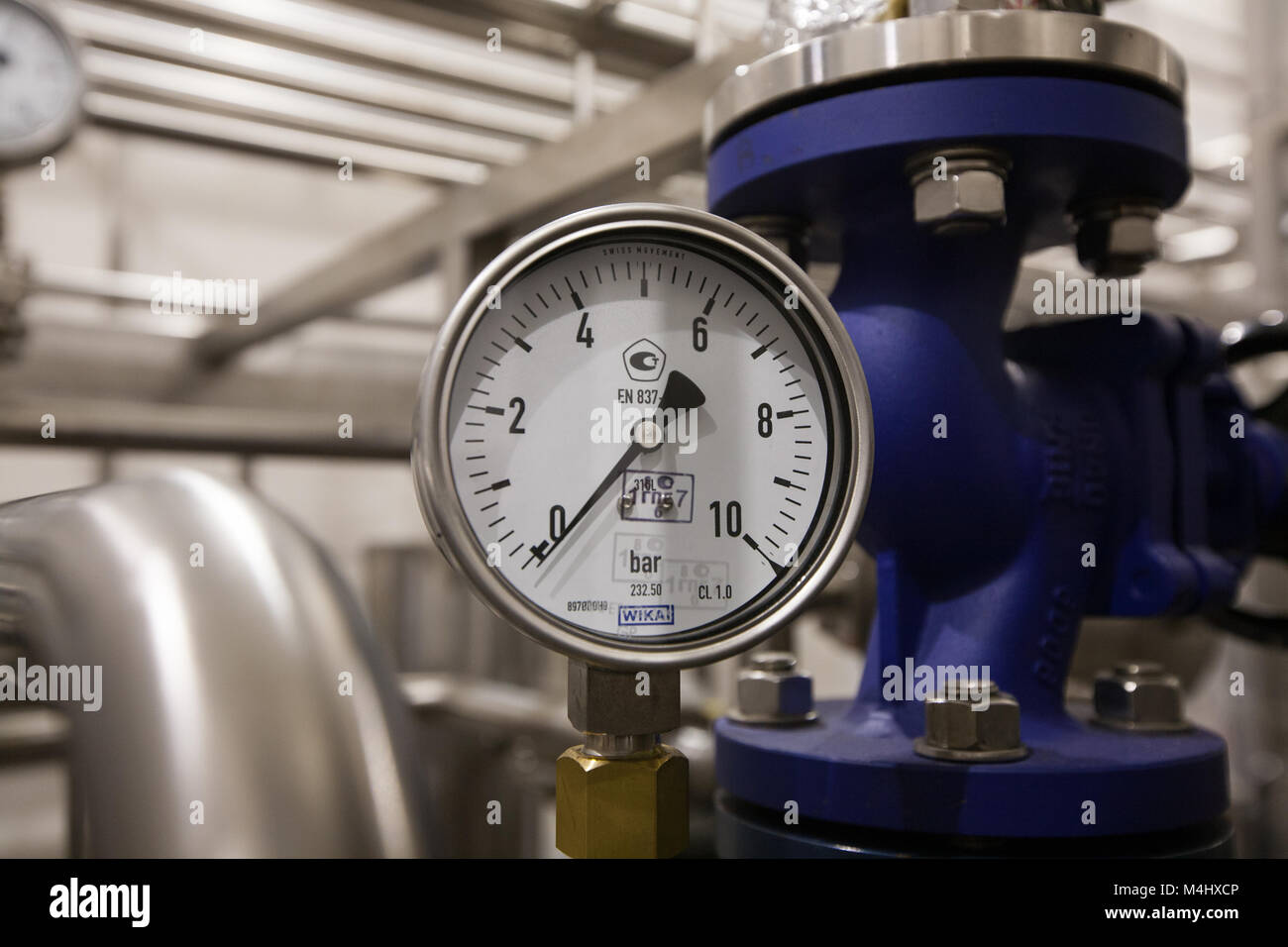 Pressure gauge (manometer) of white metal - brewing equipment. Close-up ...