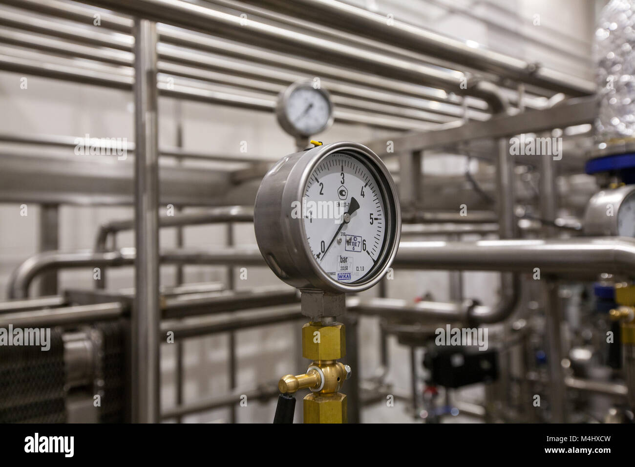 Pressure gauge (manometer) of white metal - brewing equipment. Close-up ...