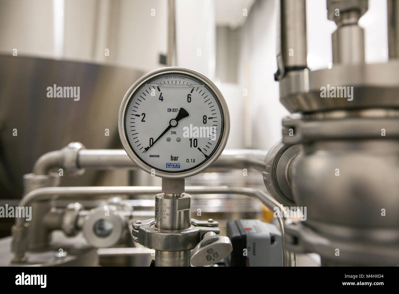 Pressure gauge (manometer) of white metal - brewing equipment. Close-up ...