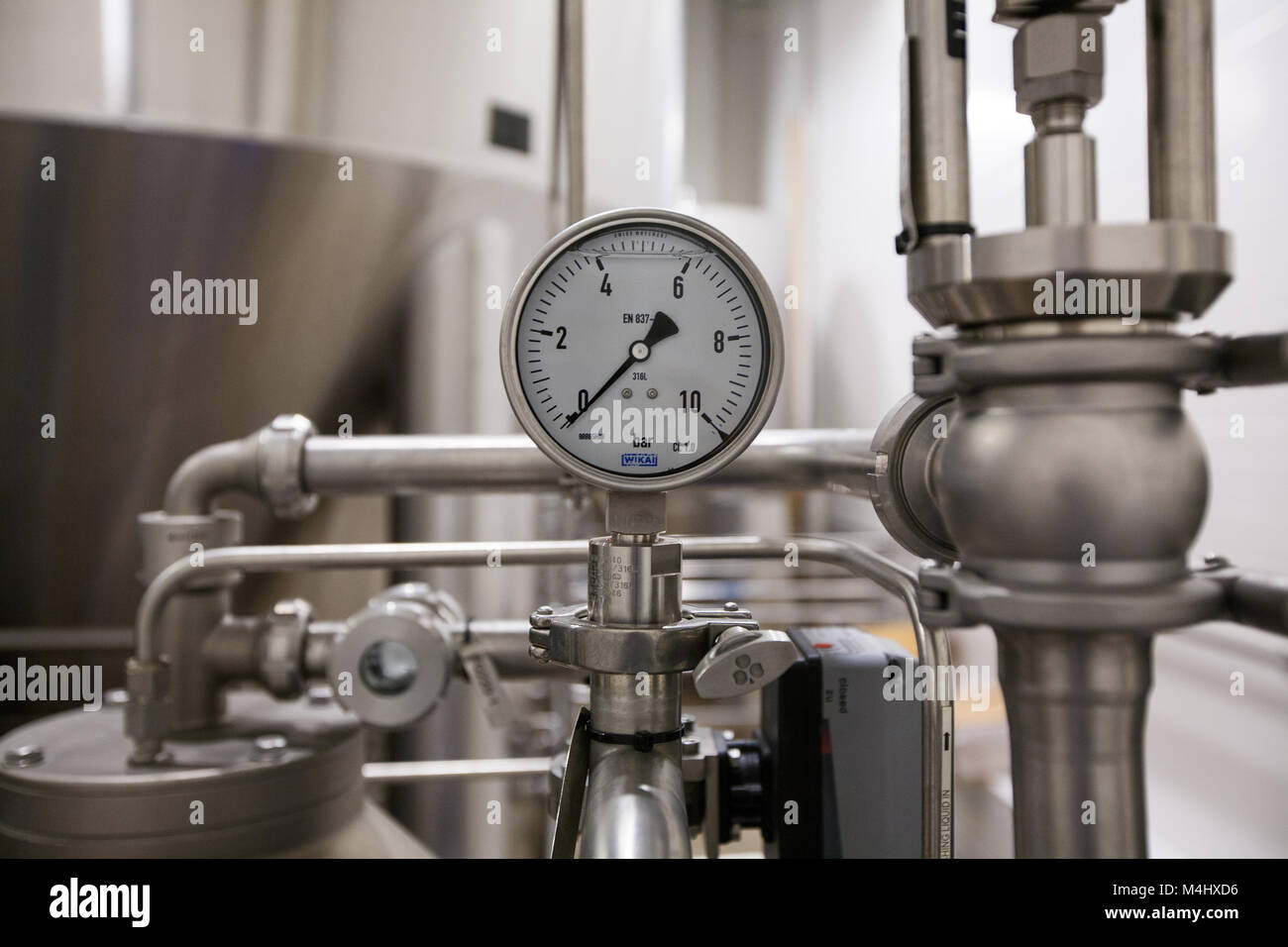 Pressure gauge (manometer) of white metal - brewing equipment. Close-up ...