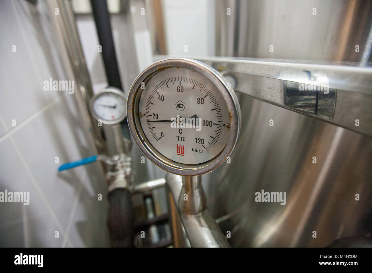 Pressure gauge (manometer) of white metal - brewing equipment. Close-up ...