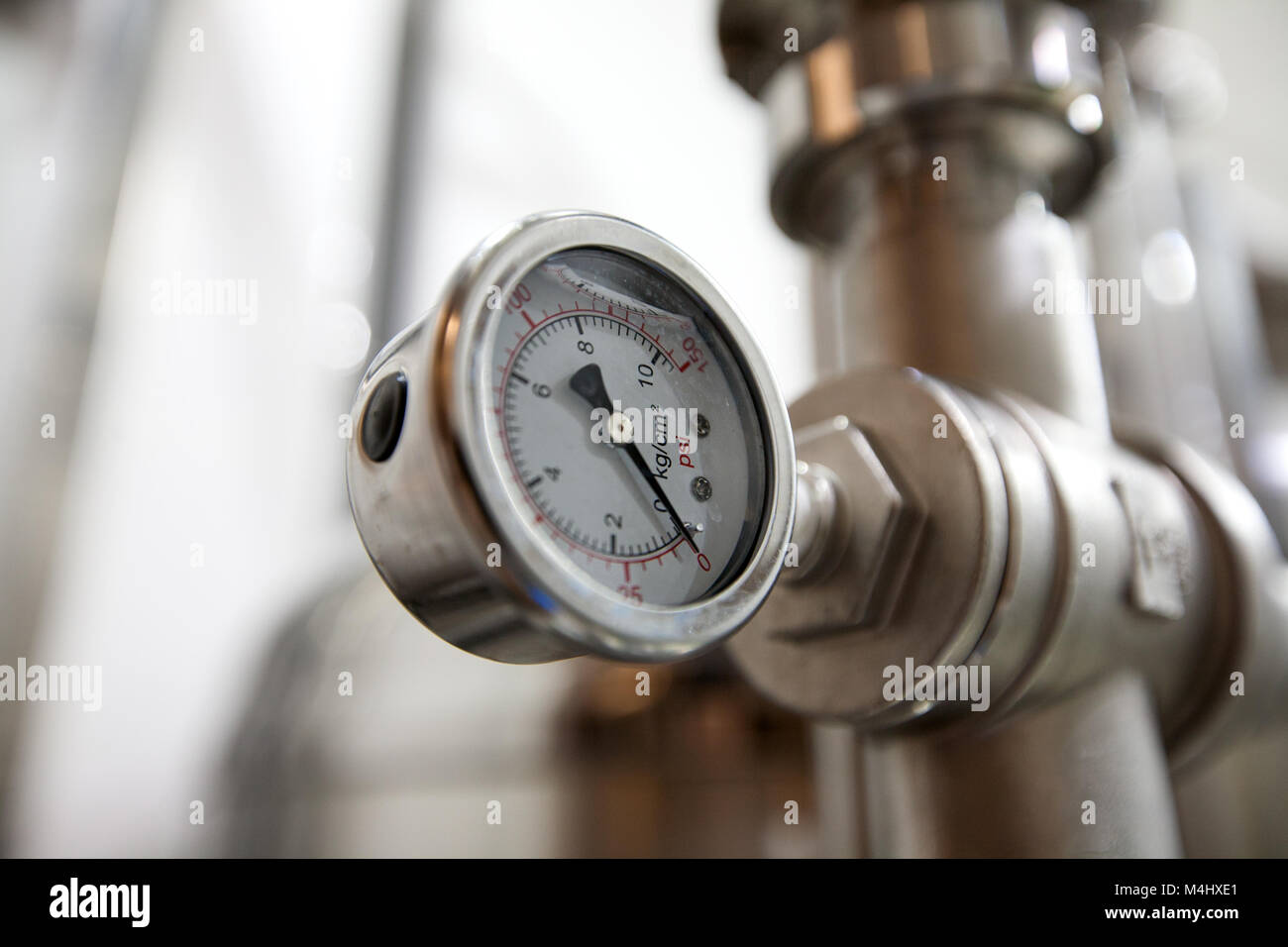 Pressure gauge (manometer) of white metal - brewing equipment. Close-up ...
