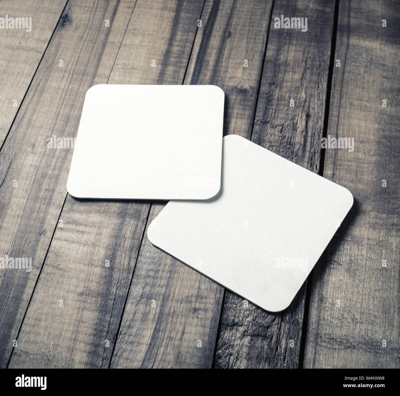 Square beer coasters Stock Photo - Alamy