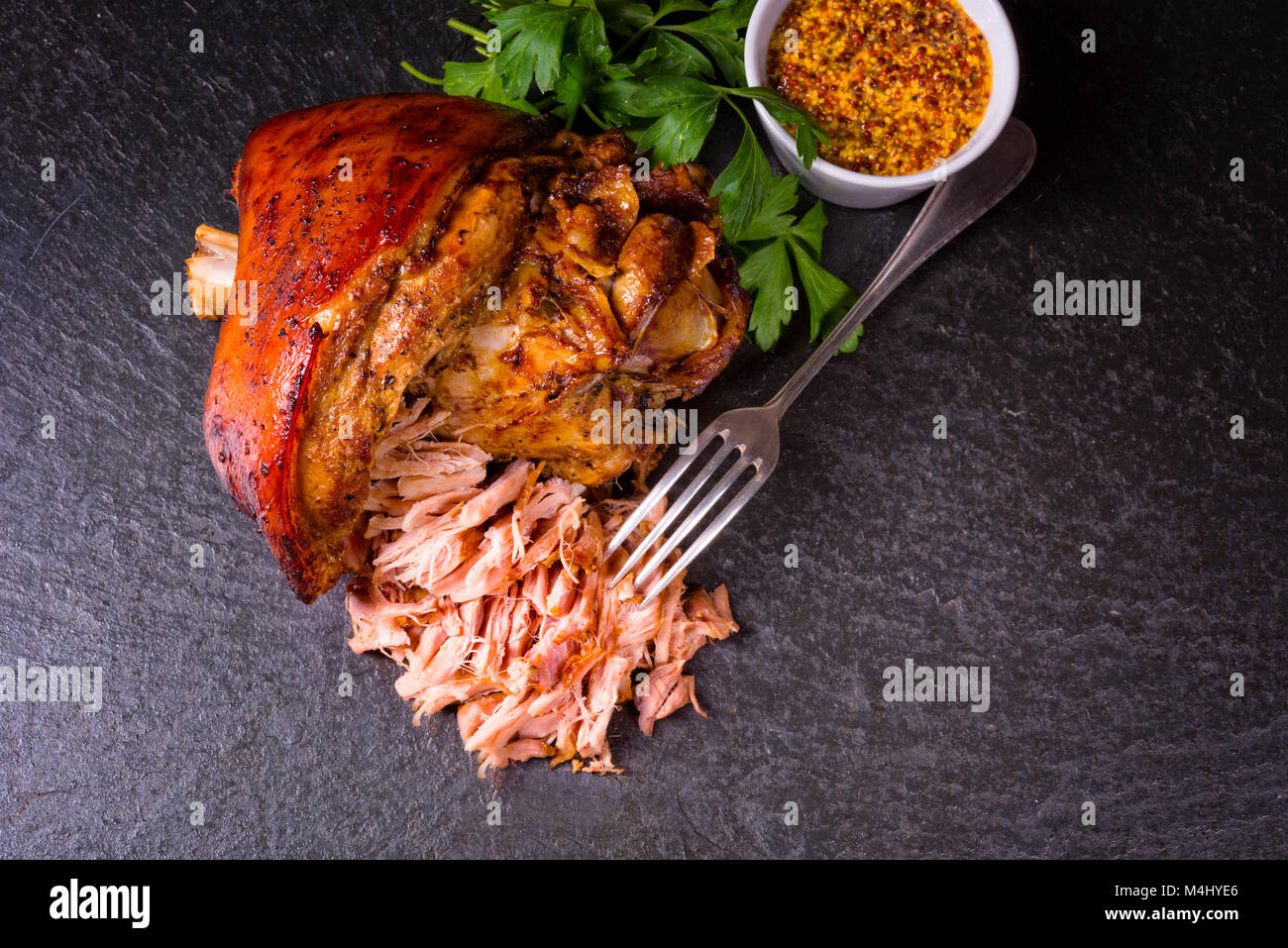 fresh roasted knuckle of pork with mustard Stock Photo - Alamy
