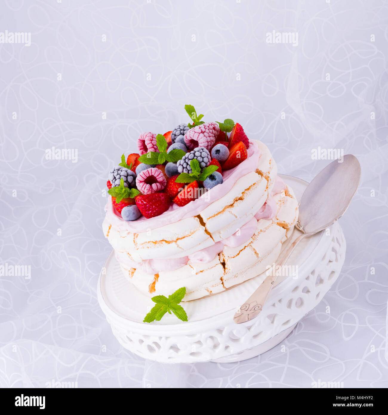 Pavlova with berry fruits Stock Photo - Alamy