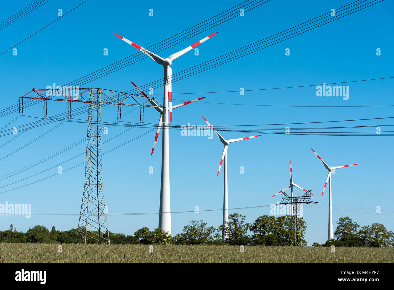 Windwheels and power transmission lines seen in rural Germany Stock ...