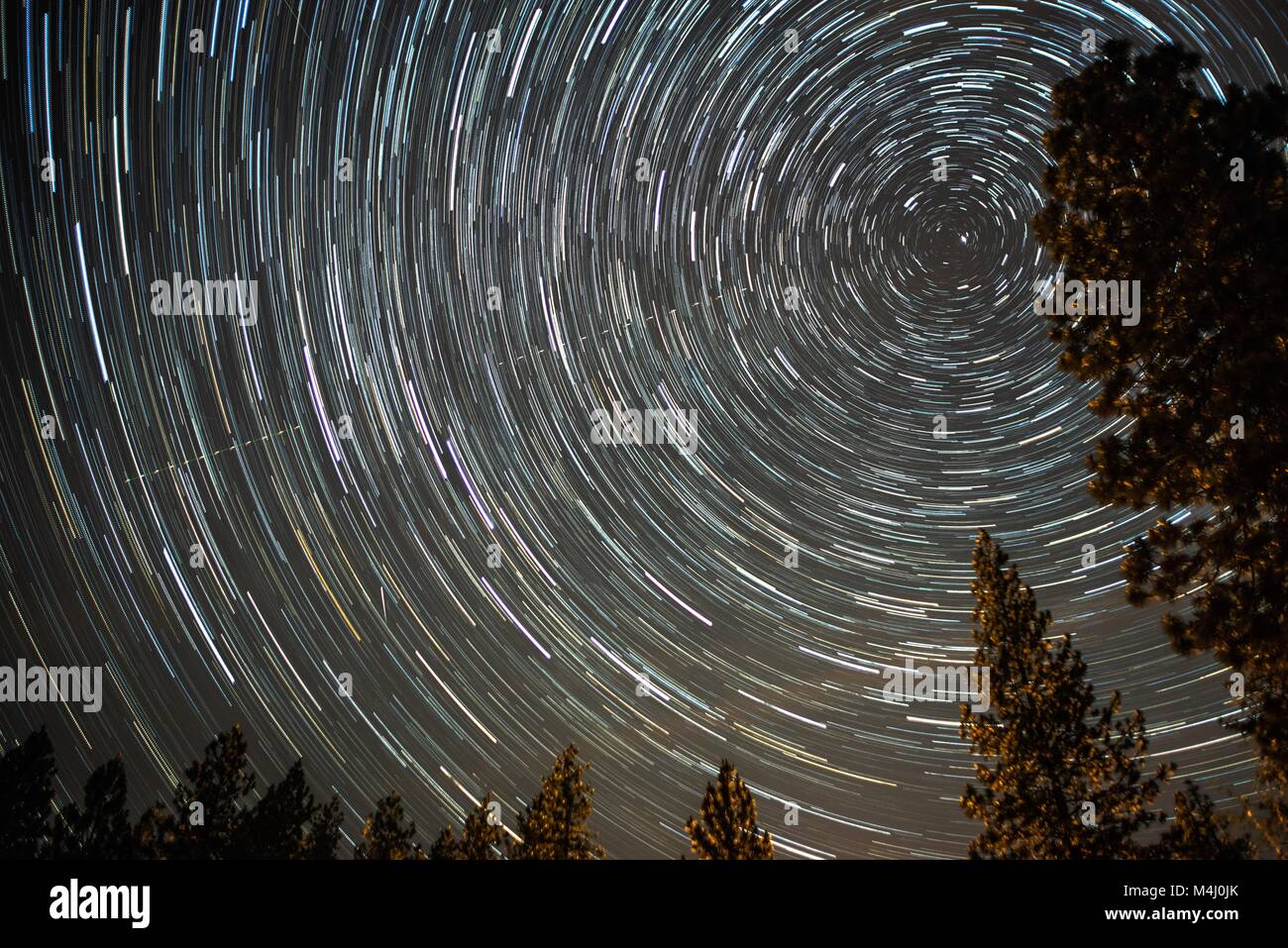 universe spiraling around north star on night sky Stock Photo - Alamy