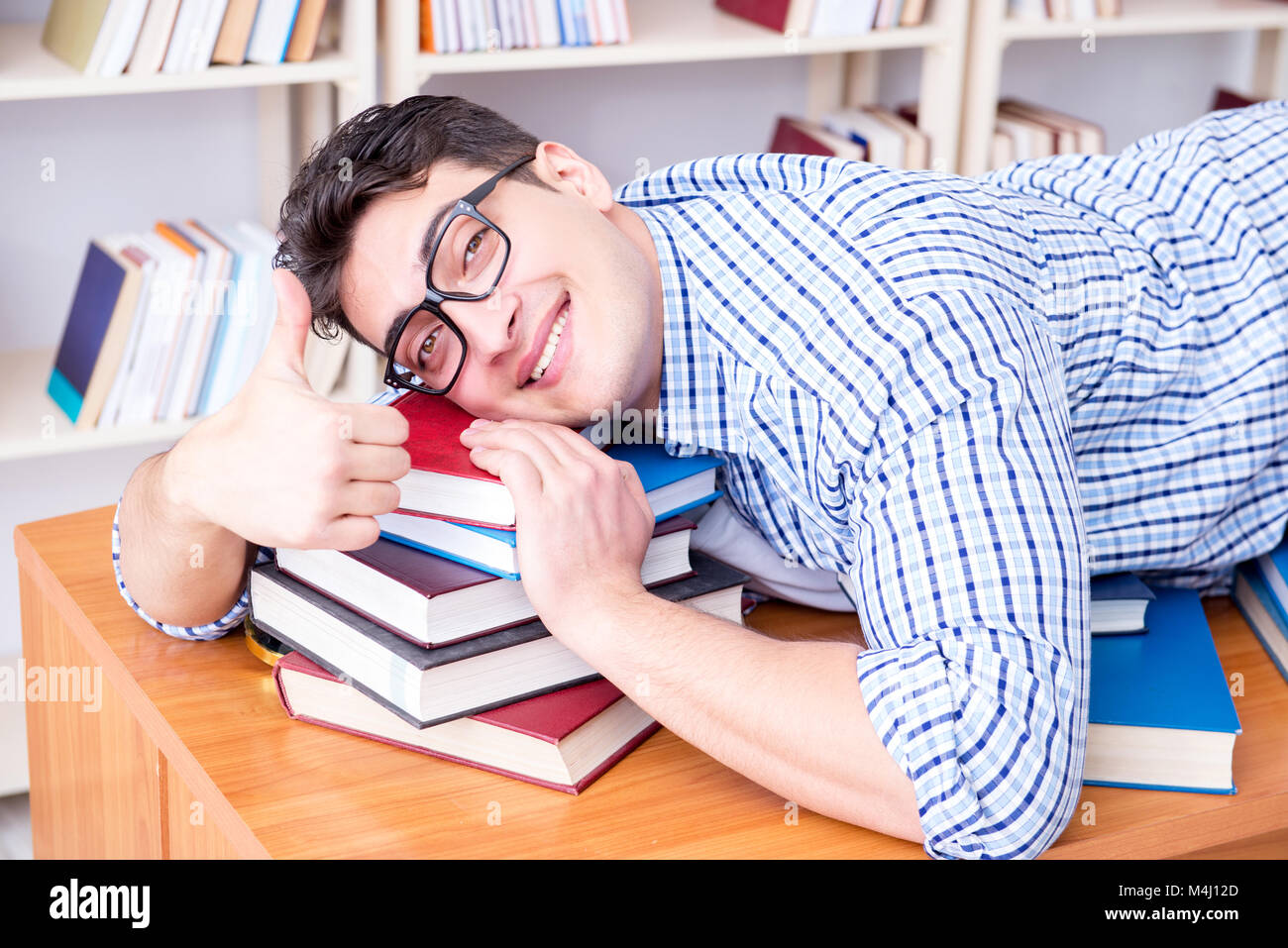 Young student taking break and falling asleep Stock Photo - Alamy
