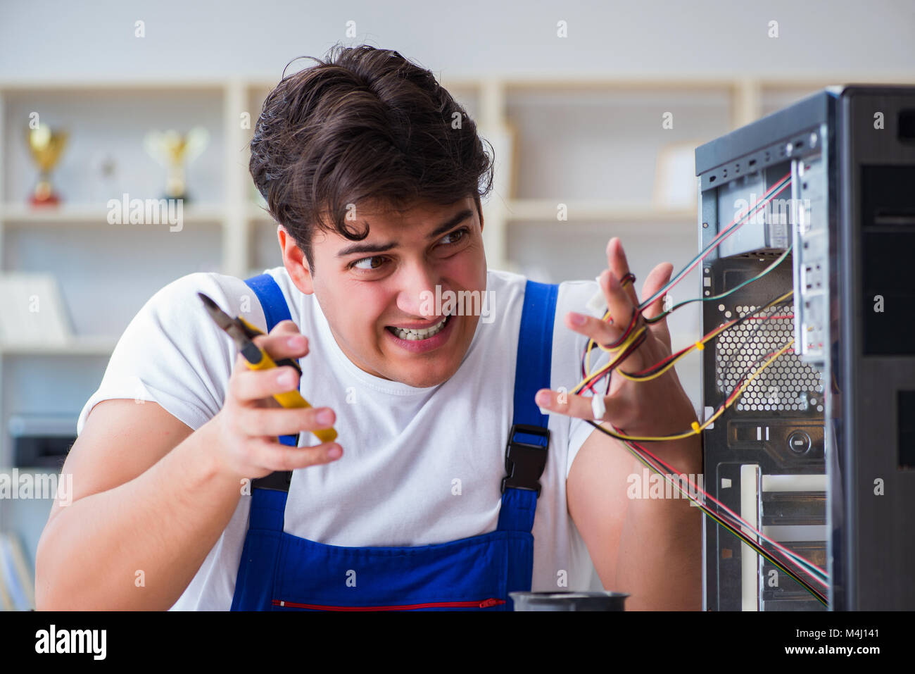 Computer repairman repairing desktop computer Stock Photo - Alamy