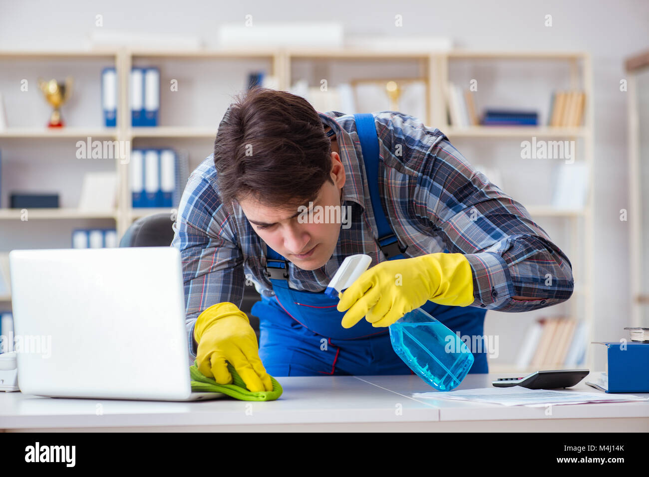 Male cleaner working in the office Stock Photo - Alamy