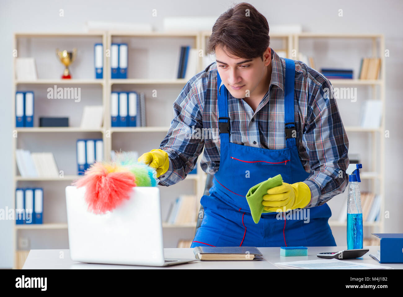 Male cleaner working in the office Stock Photo - Alamy