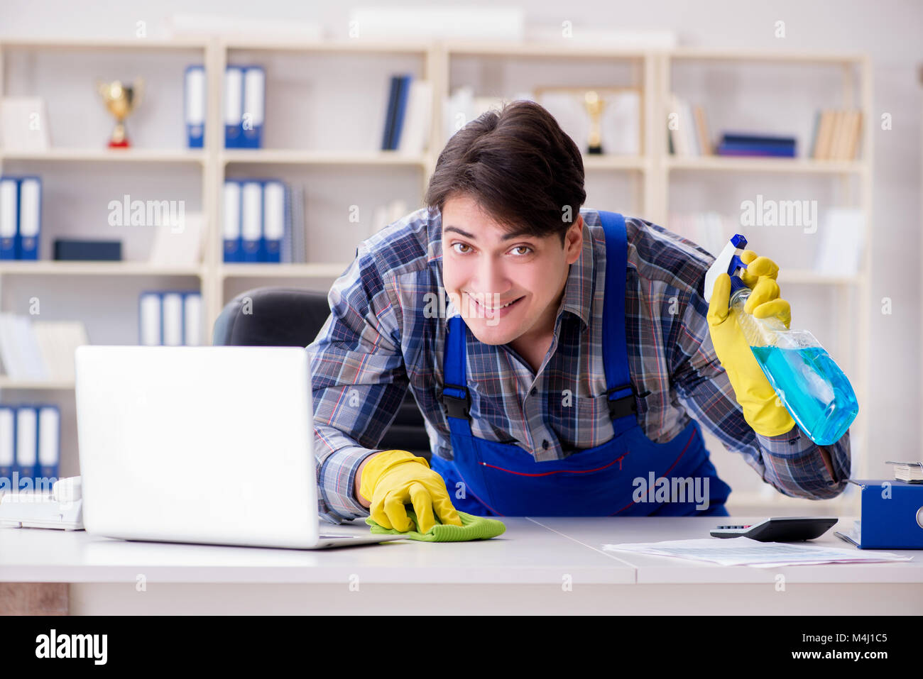 Male cleaner working in the office Stock Photo - Alamy