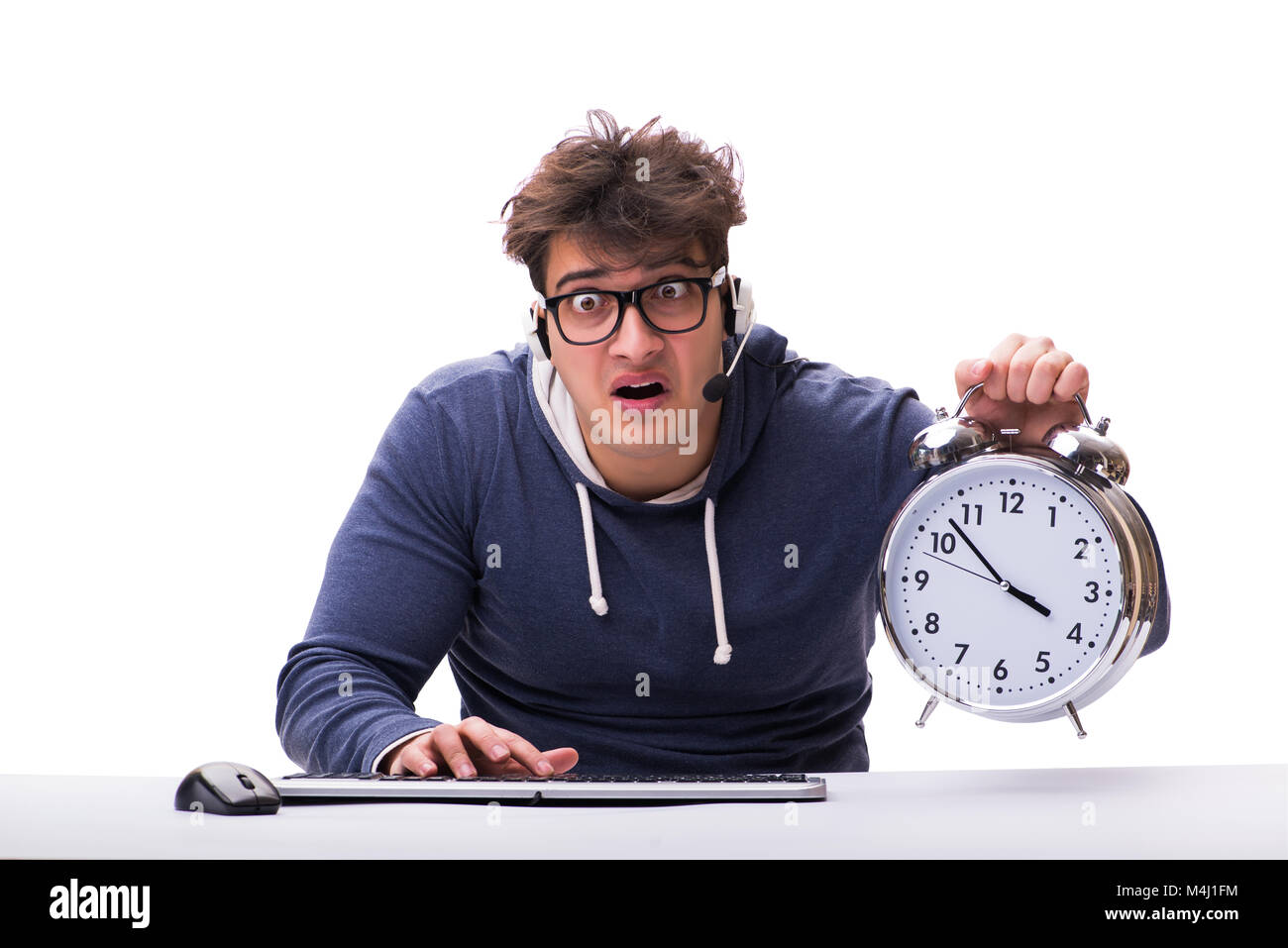 Funny nerd call center operator with giant clock Stock Photo - Alamy